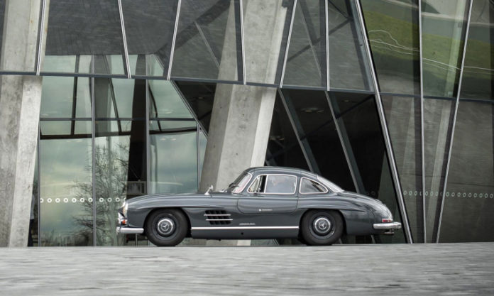 100 Mercedes-Benz 300 SL Gull-Wing Models in front of the Mercedes-Benz ...
